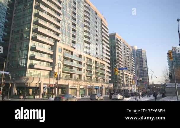 Downtown intersection surrounded by modern glass condominium buildings ...