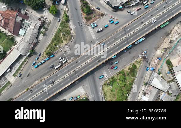 Top-down aerial perspective of a modern city flyover and intersection ...