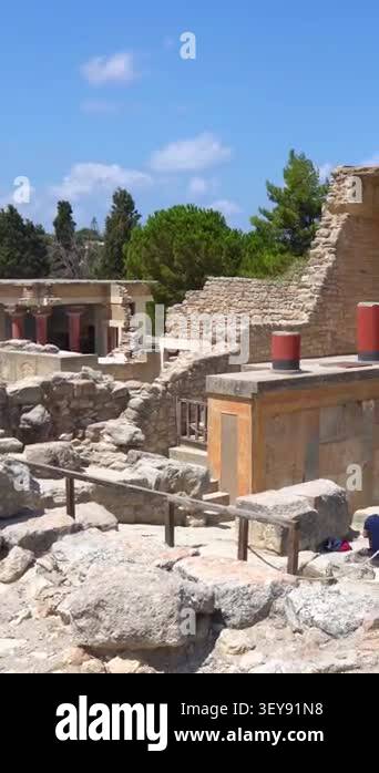 Tourists visiting the famous archaeological site of the Minoan Palace ...