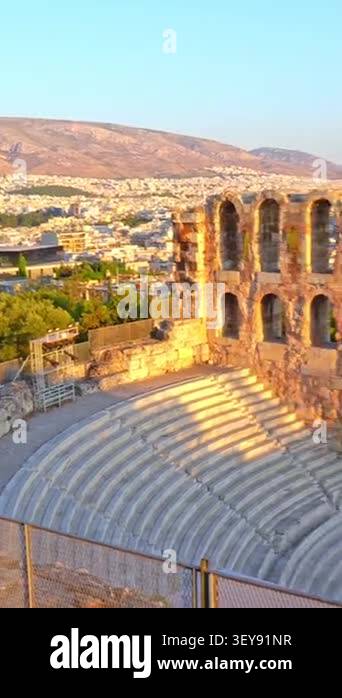 Panning view of the ancient Odeon of Herodes Atticus stone theater on ...