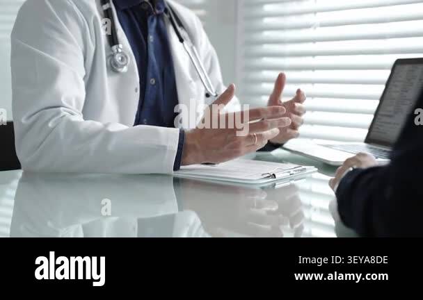 Doctor working on computer, analyzing patient data and medical records ...