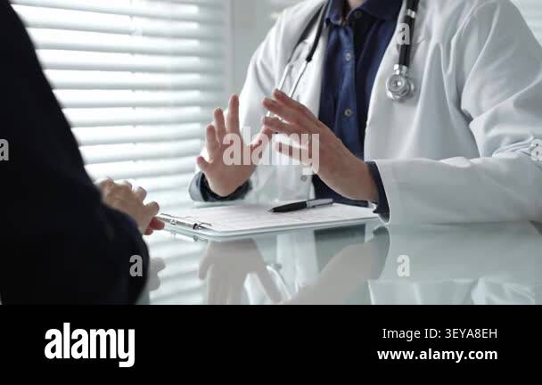 Doctor working on computer, analyzing patient data and medical records ...