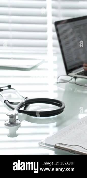 Doctor working on computer, analyzing patient data and medical records ...