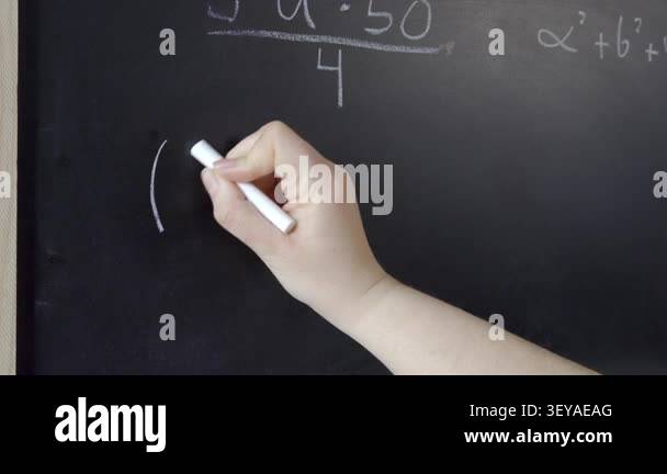 Close up on the hand of a female university teacher writing a ...