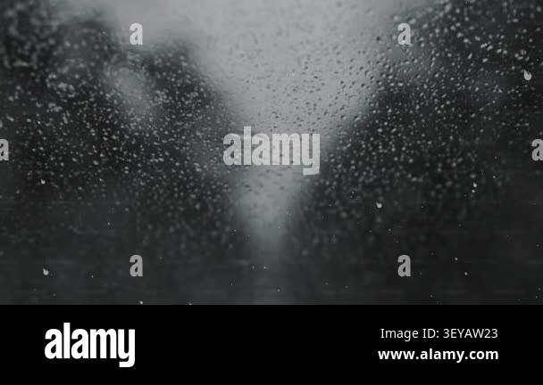 Rain drops sliding down window pane cinematic footage of stormy weather ...