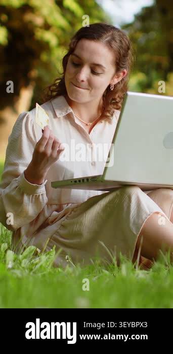 Portrait of young woman using credit bank card and laptop computer ...