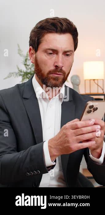 Middle-aged businessman at home office reads client rejection on ...