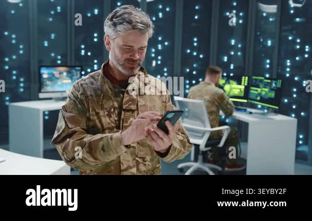 Military officer caucasian man in camouflage using smartphone ...