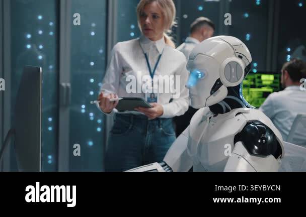 Robot working on computer programming software system project server ...