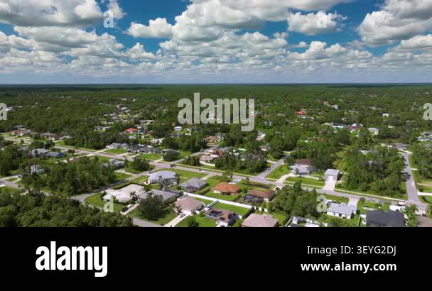 Suburban housing development with rows of modern houses and clean ...