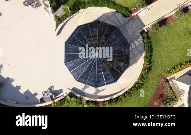 Overhead footage showing pathways, garden layout, and apartment ...