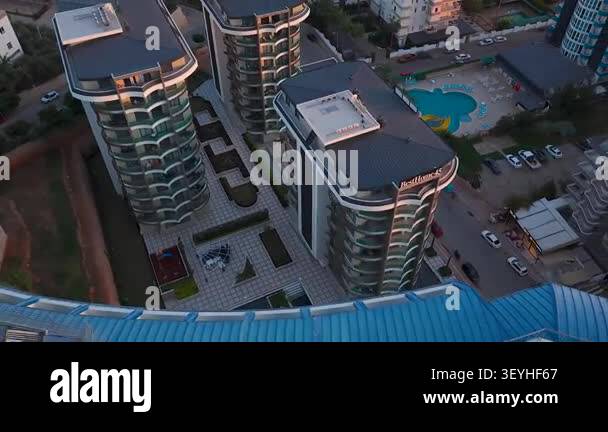 Front-facing drone shot highlighting symmetry of buildings and central ...