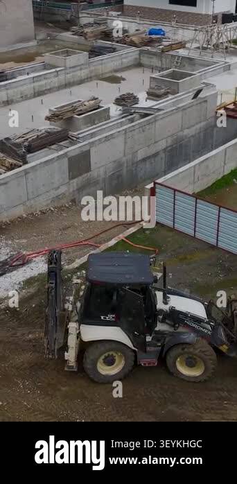Drone shot capturing heavy machinery and building process Stock Video ...