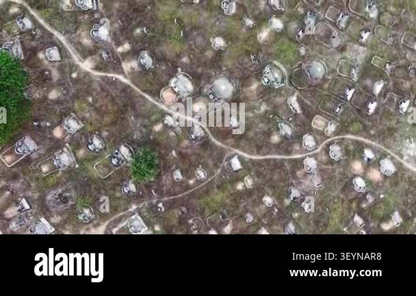 Drone overhead shot of Chinese cemetery graves and pathways in Kulim ...