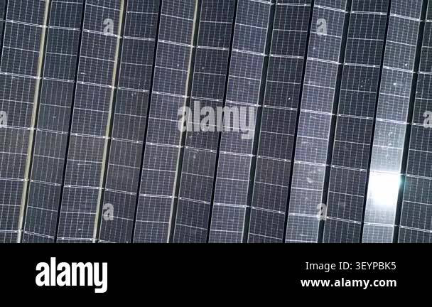 Aerial top down view of a huge solar panel array on a rooftop ...