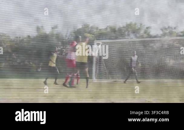 Sports male players contesting ball after cross into goal, overlay ...