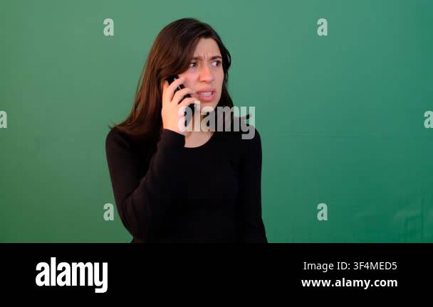 Woman talking phone on green screen, unhappy and angry caucasian woman ...
