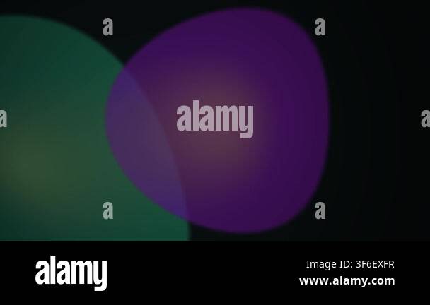 Vibrant purple and green shapes on black Stock Video Footage - Alamy