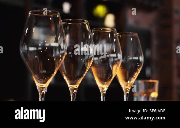 Elegant empty champagne glasses arranged on a bar or restaurant table ...