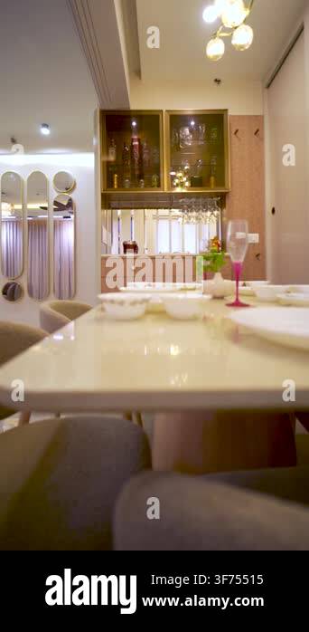 A stylish dining area featuring a modern table, elegant chairs, and a ...