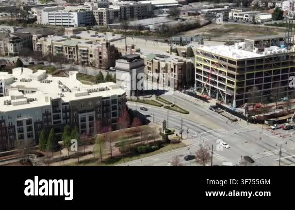 Aerial footage shows new apartment blocks and open parking decks facing ...
