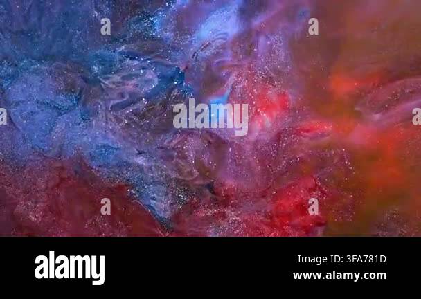 An artist uses alcohol ink and video art to create abstract forms in a ...