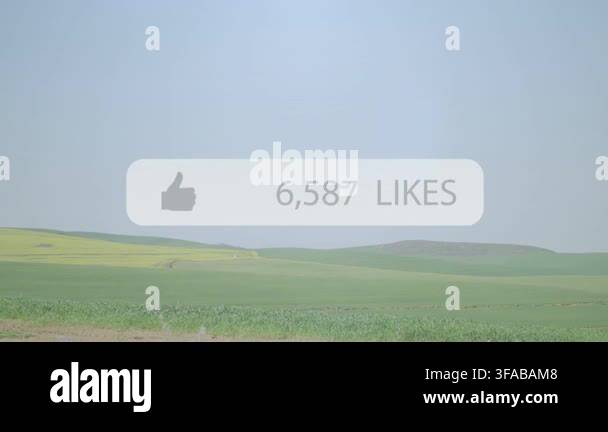 Centered white like bubble hovering over green fields showing thumbs-up ...