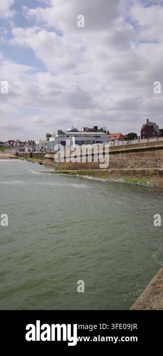 Portrait vertical slow motion footage of Bridlington seafront in East ...