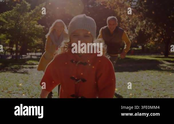 Child running to camera, parents chasing trying to catch during family ...