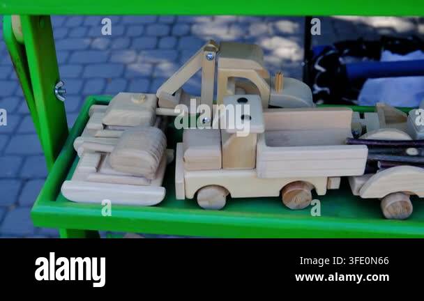 Collection of handmade wooden toy vehicles including cars, trucks ...