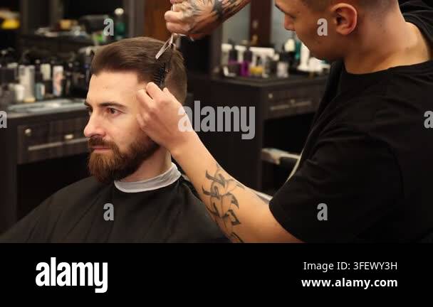 Stylist cutting man's hair with scissors in barbershop Stock Video ...