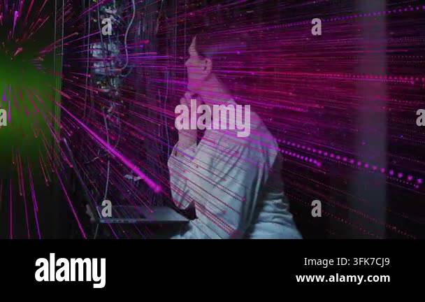 Woman operator noticing magenta streaks, green burst leaning typing ...