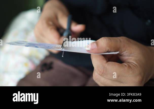 Person Cutting a Twenty Euro Banknote with Scissors Stock Video Footage ...