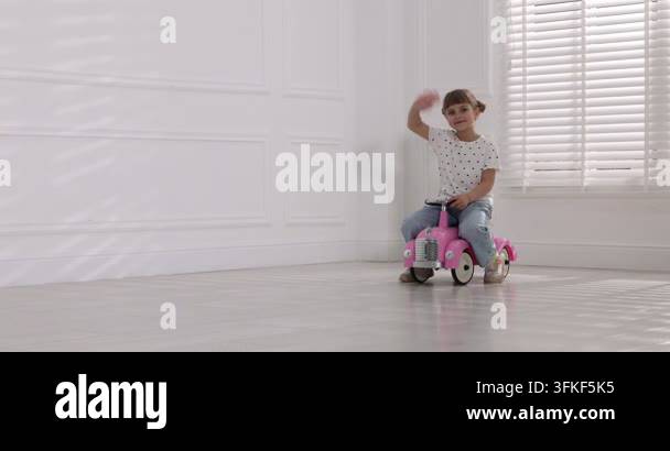 Little child driving toy car at home Stock Video Footage - Alamy