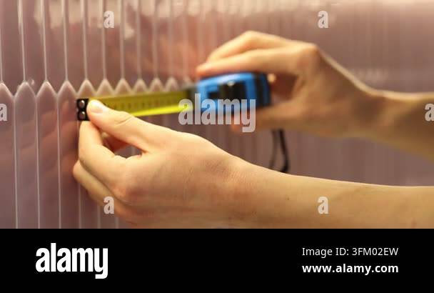 Man measuring peel and stick tales with tape indoors, closeup Stock ...