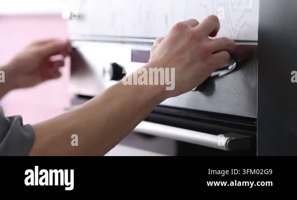 Man measuring oven with tape indoors, closeup Stock Video Footage - Alamy