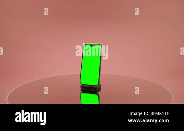 Centered view presents smartphone with green chroma key display and ...