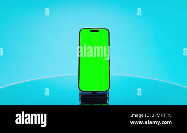 Close composition presents smartphone with green chroma key display and ...