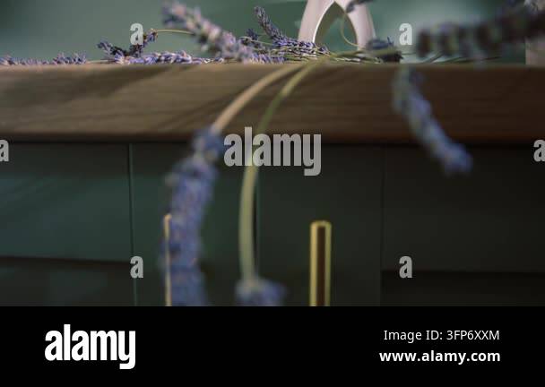 Lavender flowers and oil burner on home green cabinet medium tilting 4k ...