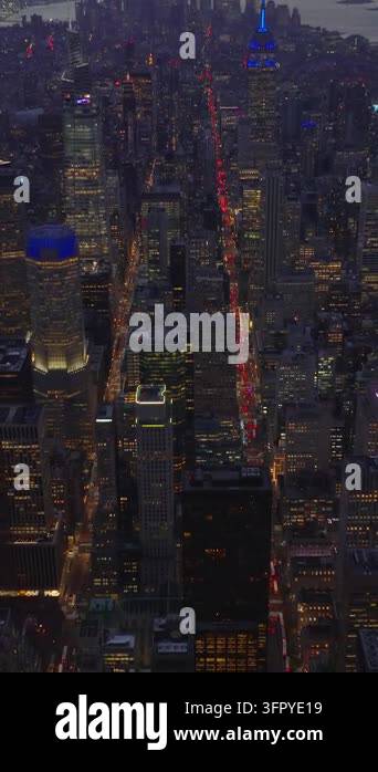 Vertical video: High angle view of long straight avenues passing city ...