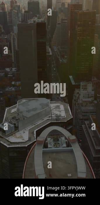 Vertical video: High angle view of high rise buildings in midtown. Tilt ...