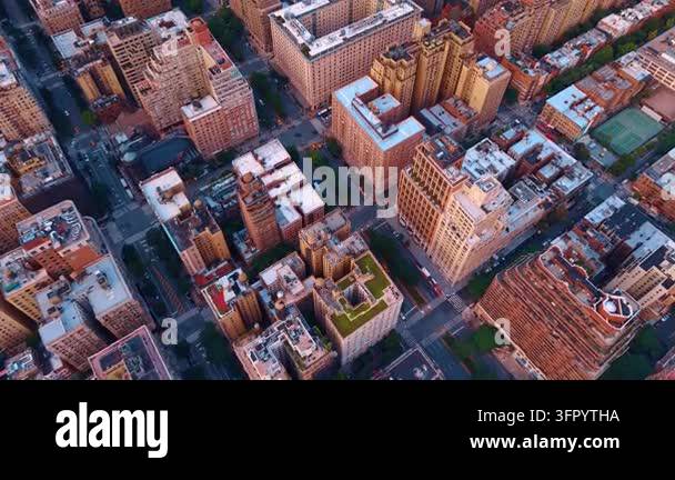 Footage over the high-rise red brick buildings of modern New York City ...