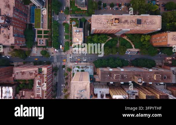 High-rise buildings, lots of greenery and streets with multiple cars ...