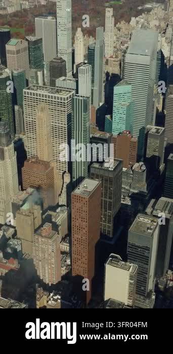 Vertical video: High angle view of high rise office and apartment ...