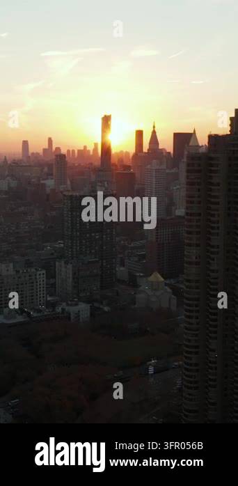 Vertical video: Slider of high rise buildings in city. Romantic view of ...