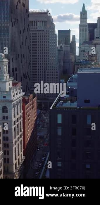 Vertical video: Aerial footage of long straight Broadway street ...