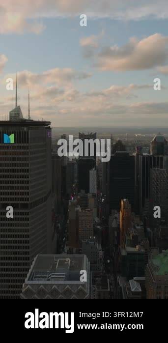 Vertical video: Slider of high rise buildings in midtown. Aerial ...