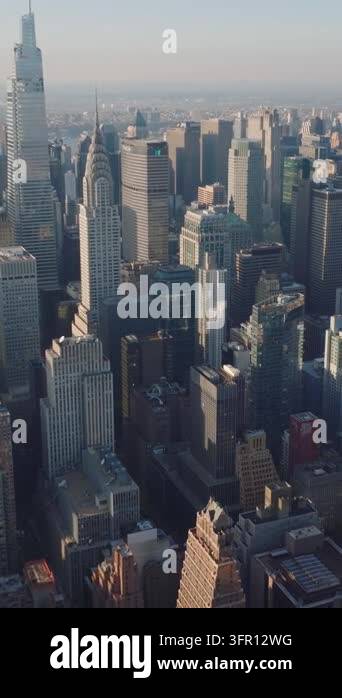 Vertical video: High angle view of development in midtown. High rise ...