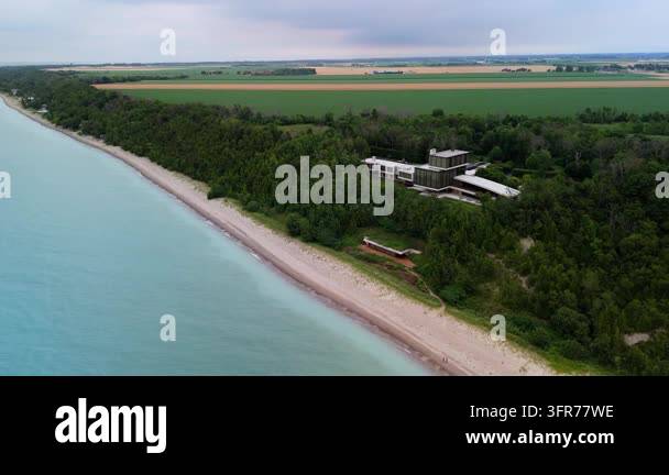 Coastal landscape displaying sandy beach light blue water green forest ...
