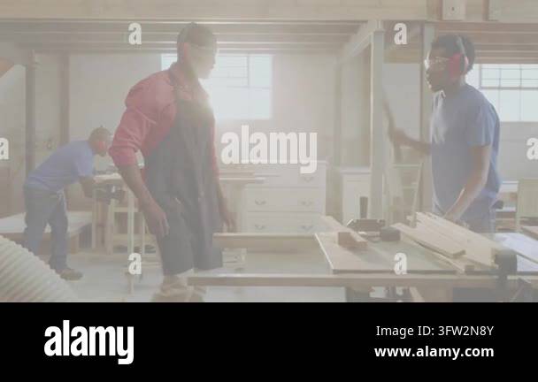 Vertical video: Red-shirt teaching blue trainee at shop after setup ...